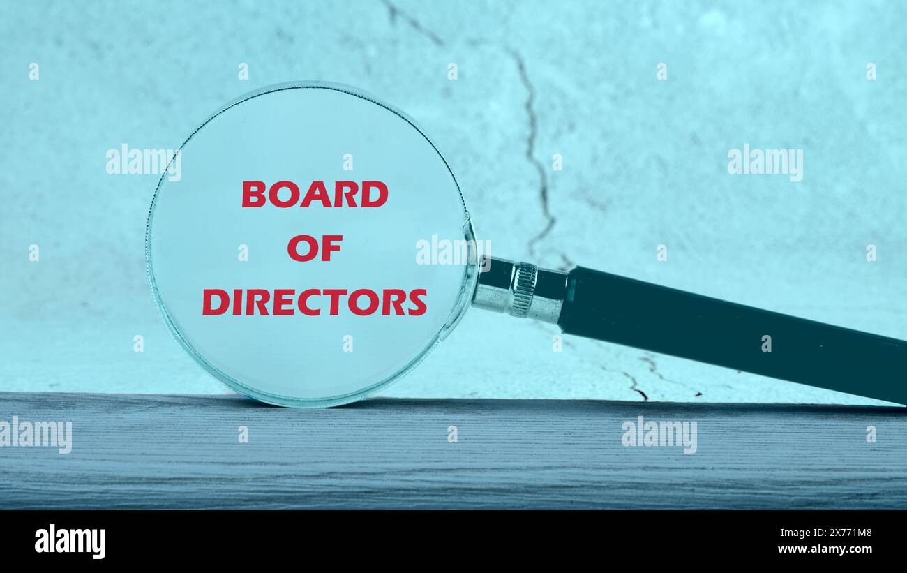 Business concept. Words BOARD OF DIRECTORS through a magnifying glass ...