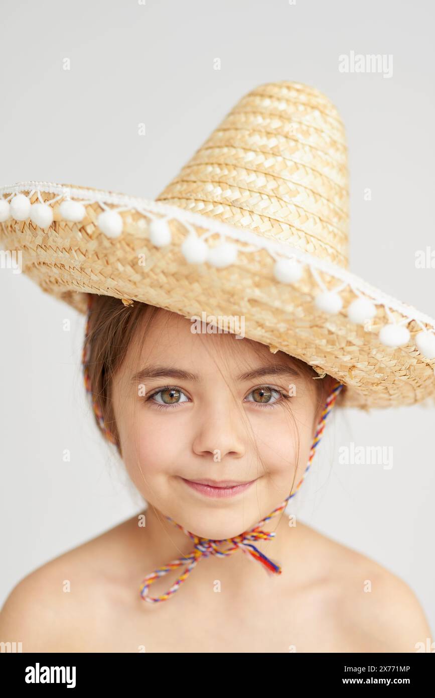 Fashion, straw hat and portrait of child in studio with traditional ...