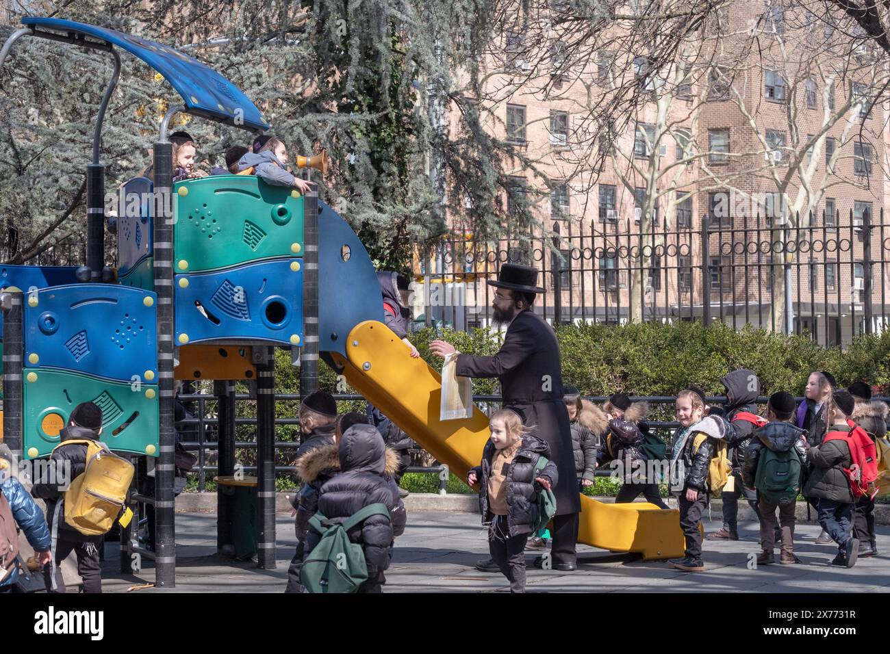 With their Rabbi supervising, a group of young Jewish students play in ...