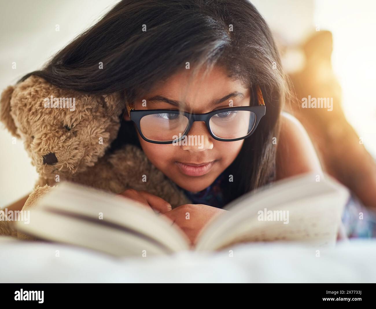Kid, girl and reading book for home learning, education or story with ...