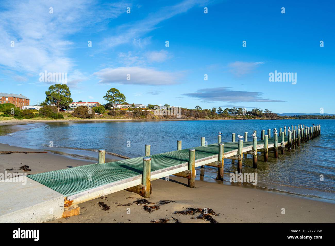 Long jetty at boat ramp, Jubilee Beach Swansea, Tasmania Stock Photo ...