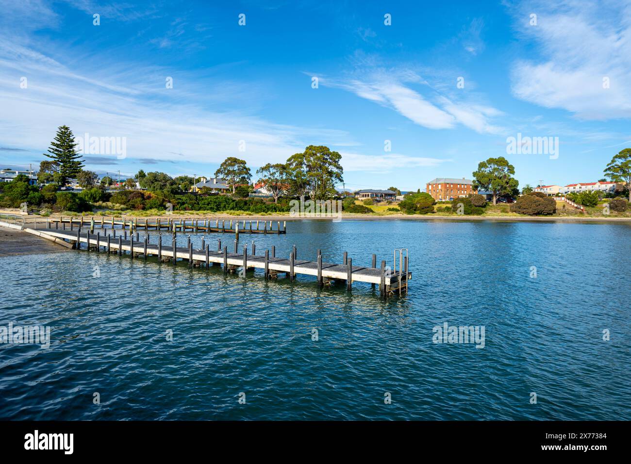 Long jetty at boat ramp, Jubilee Beach Swansea, Tasmania Stock Photo ...