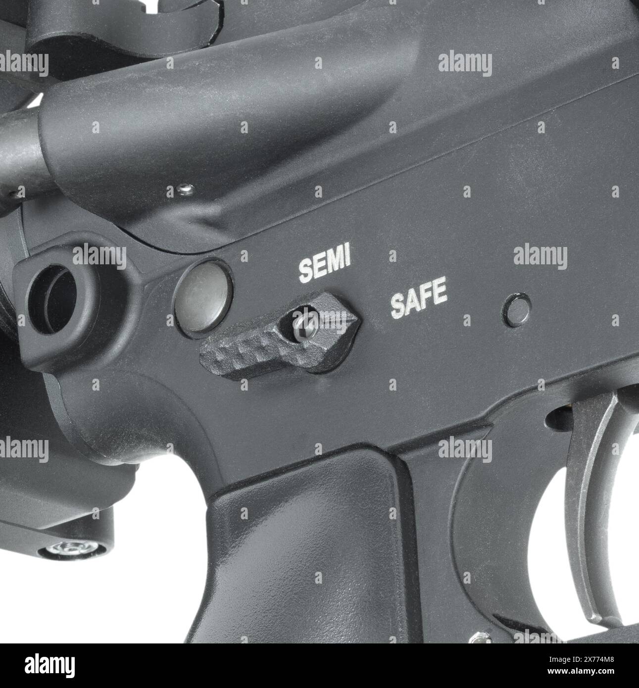 Low angle look at the safety switch on an AR-15 isolated in a studio ...