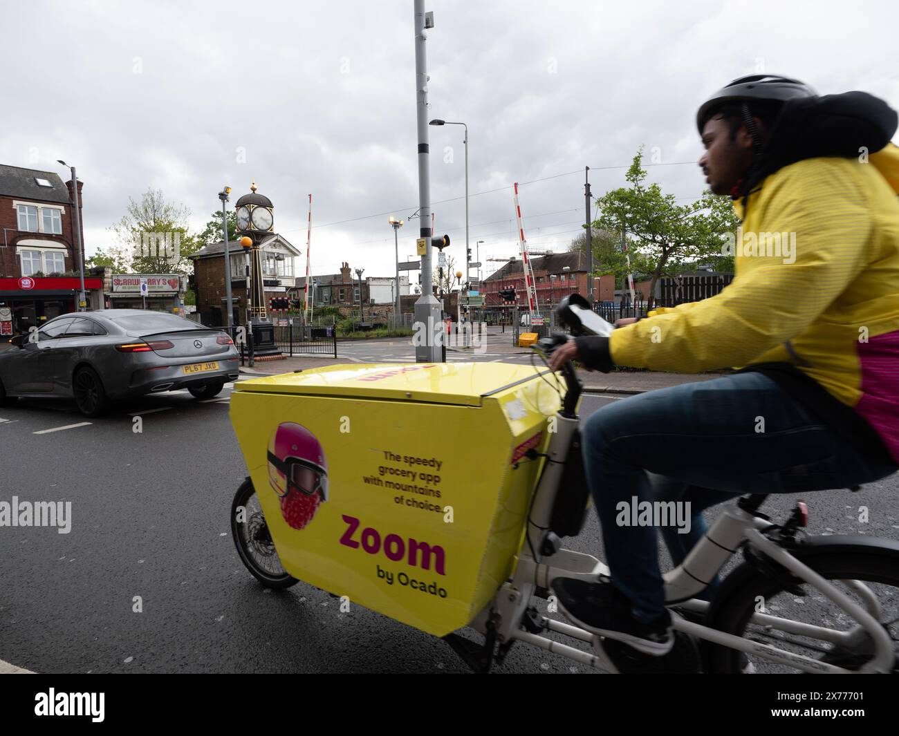 Zoom by Ocado delivery cyclist on e-bike, Highams Park London UK Stock Photo - Alamy