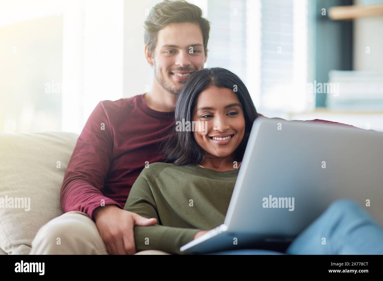 Couple, remote work and woman with bonding in home, laptop and working ...
