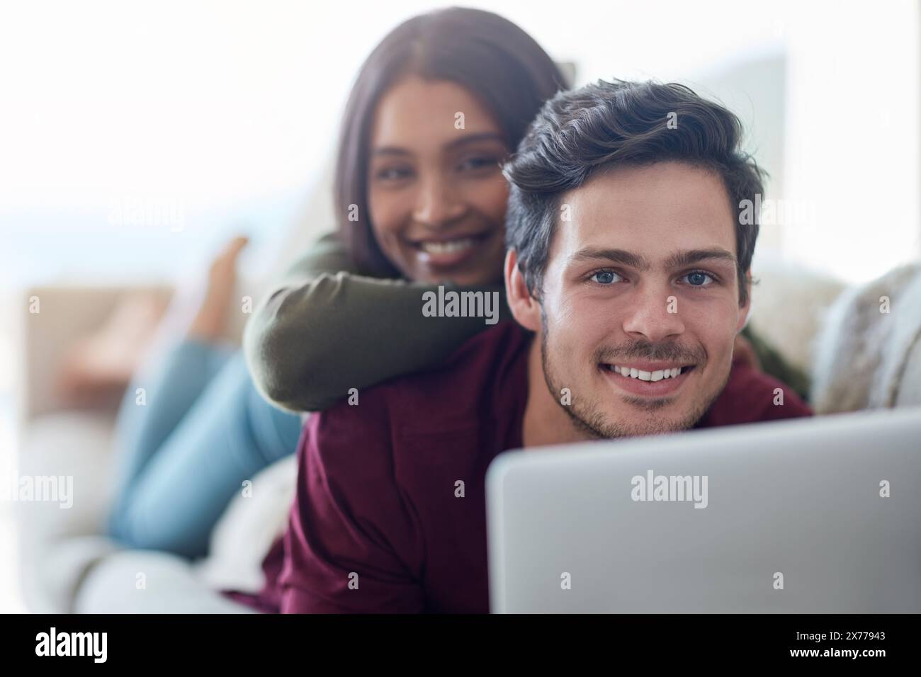 Couple, watch and laptop for movies, internet and entertainment of ...