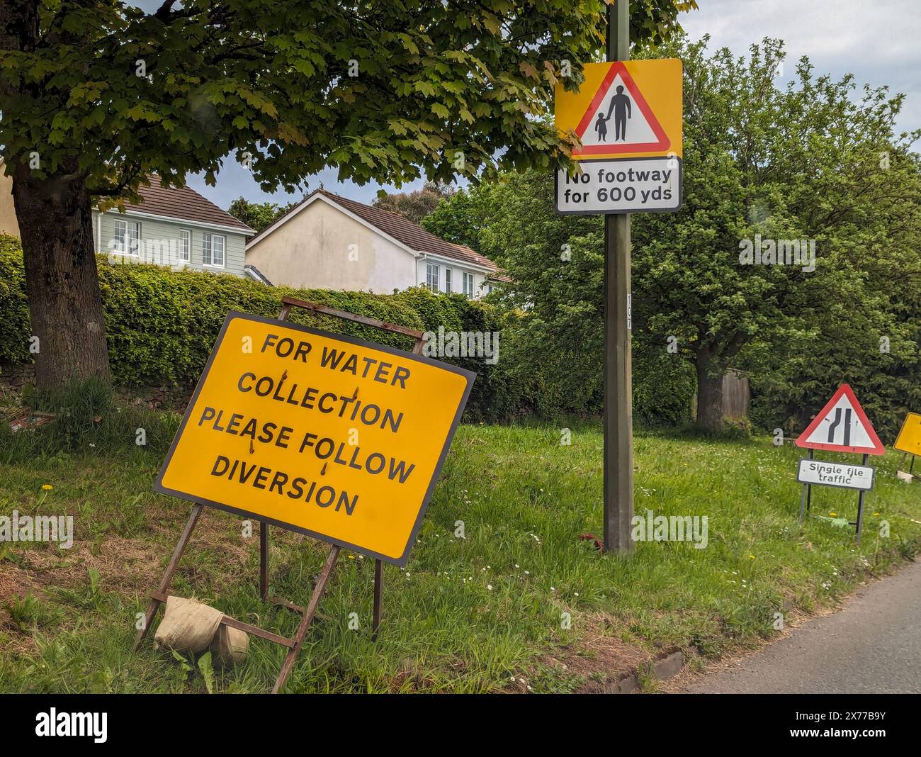 Brixham, UK. 18th May, 2024. A road sign for residents picking up water ...