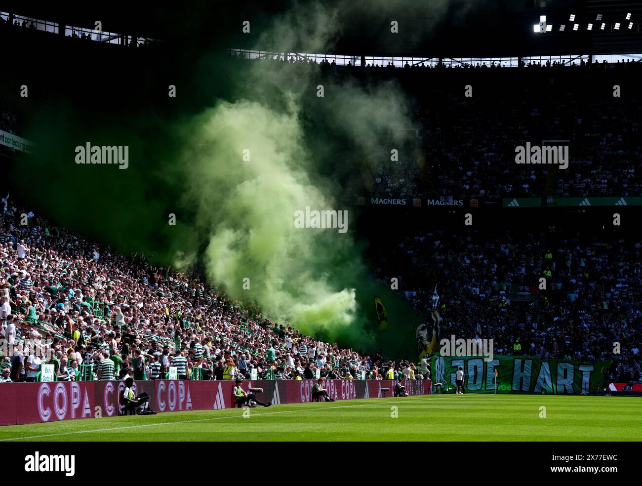 Celtic fans set off green smoke flares in the stands during the cinch ...