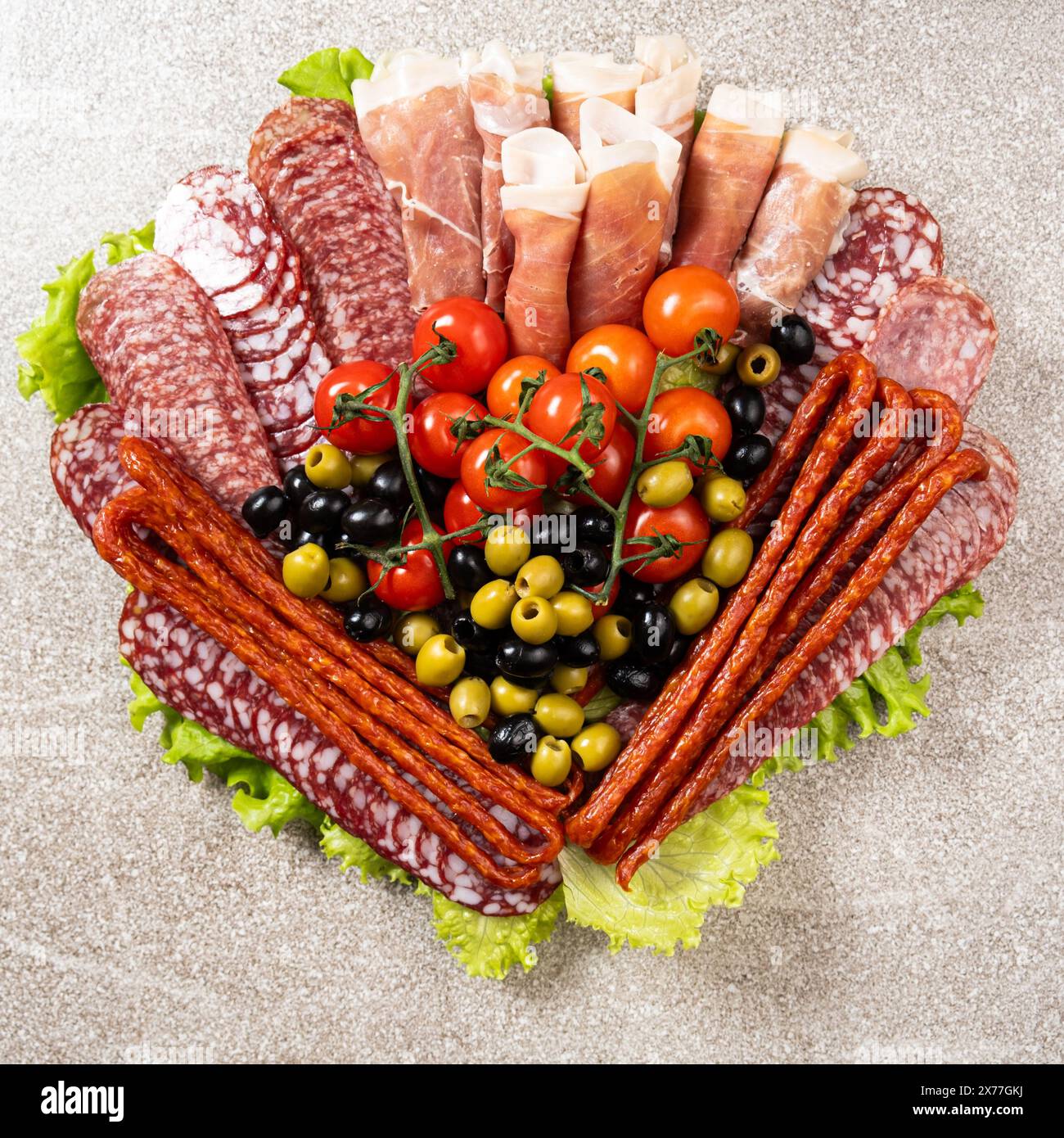Beautiful serving of sausage sliced meat delicacies Stock Photo - Alamy