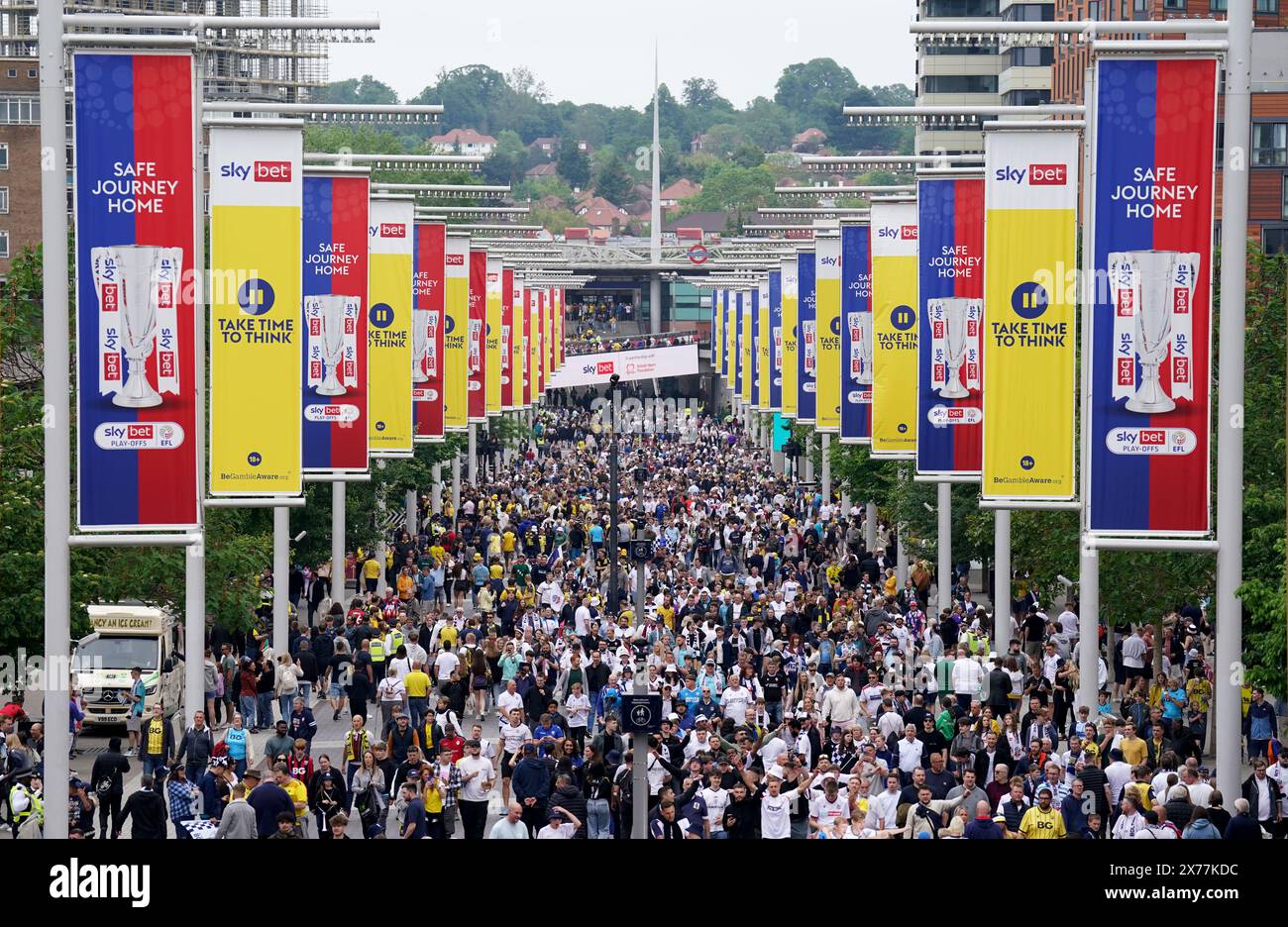 Fans walk down Olympic Way from Wembley Park station to the stadium ...