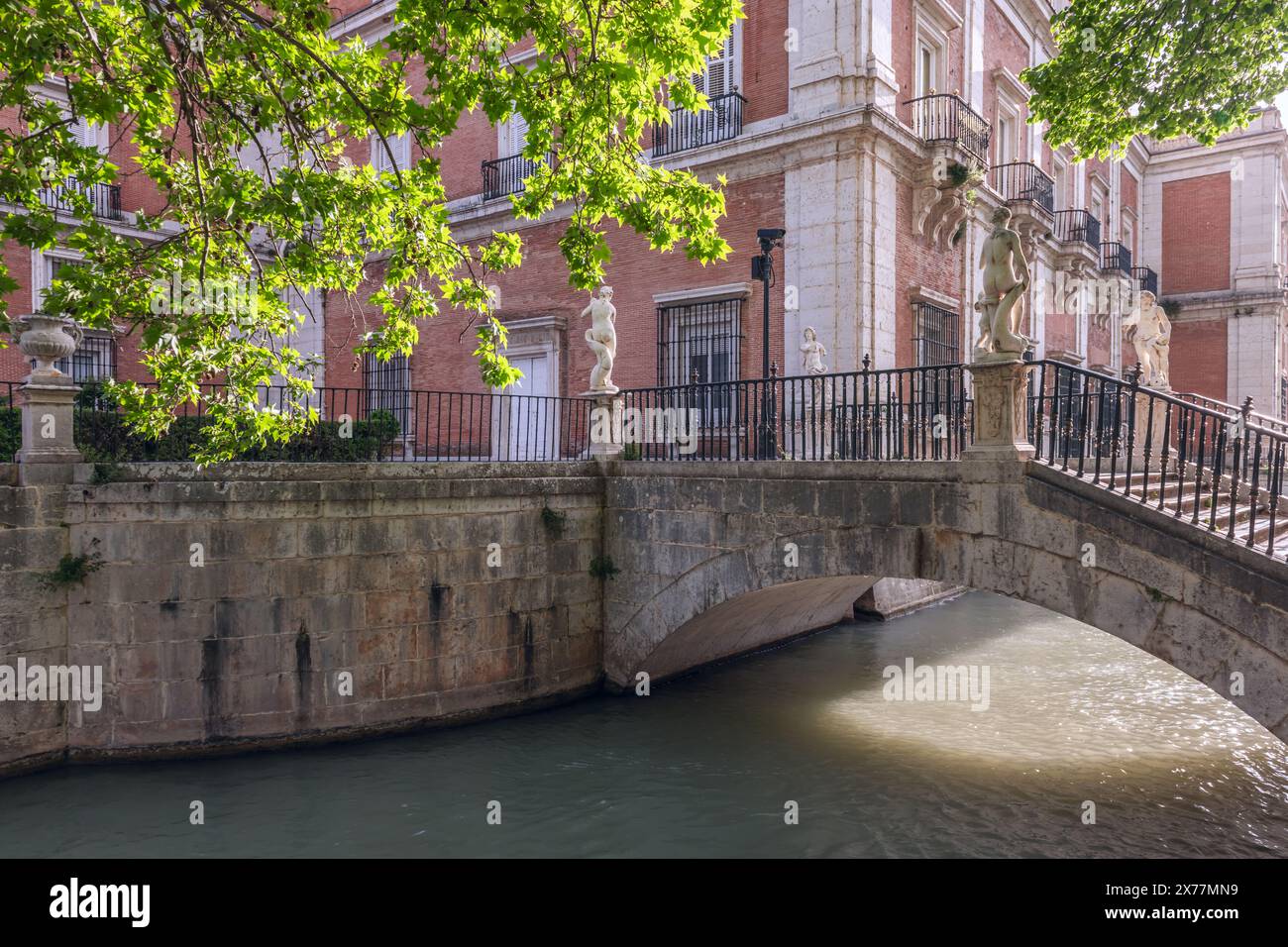 water channel through stone walls with beautiful stone bridges among ...