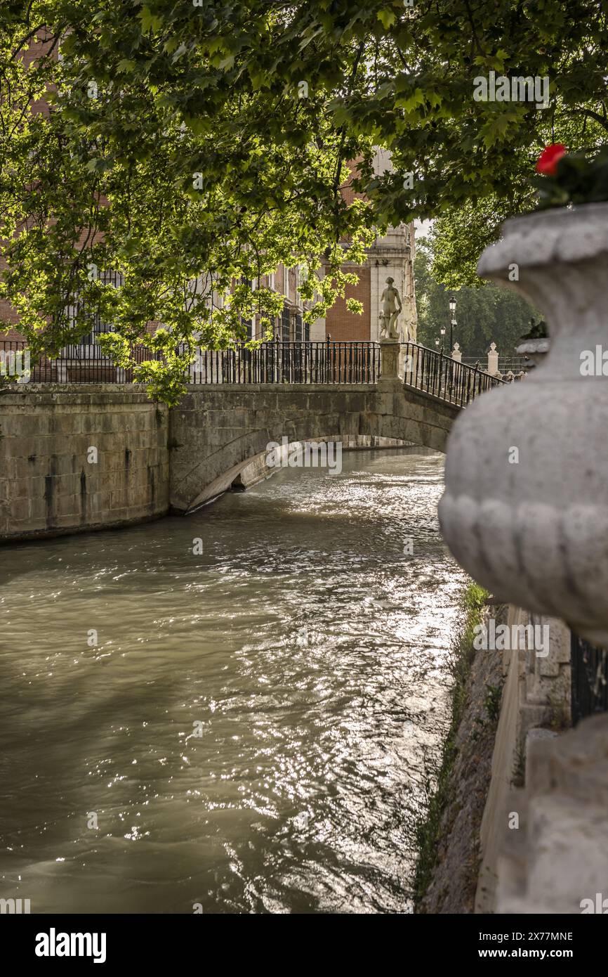 A water channel through stone walls passing through a monumental park ...