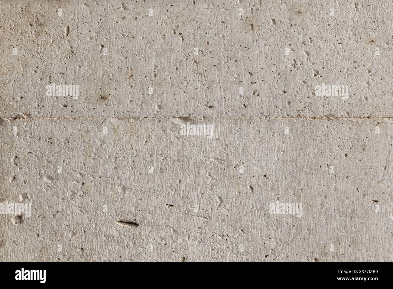 A white stone wall with porous surface. Vector white stone texture ...