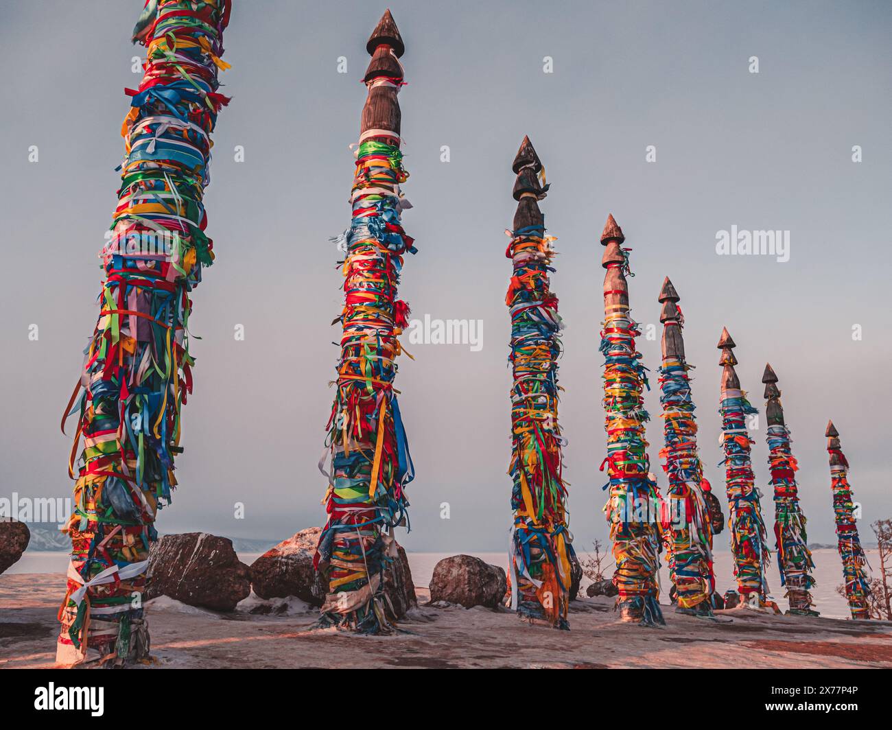 Traditional buryat shaman sacred pillars with colorful ribbons in ...