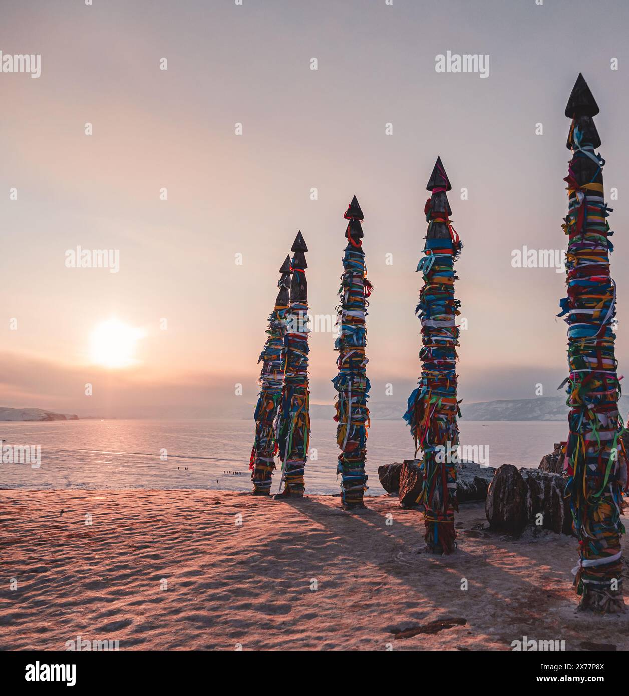 Traditional buryat shaman sacred pillars with colorful ribbons in ...