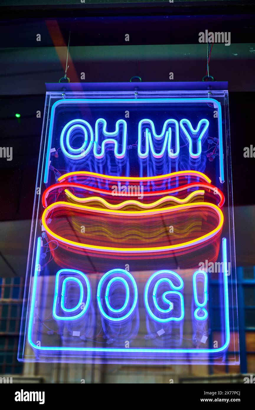 Neon sign advertising hot dogs Stock Photo - Alamy