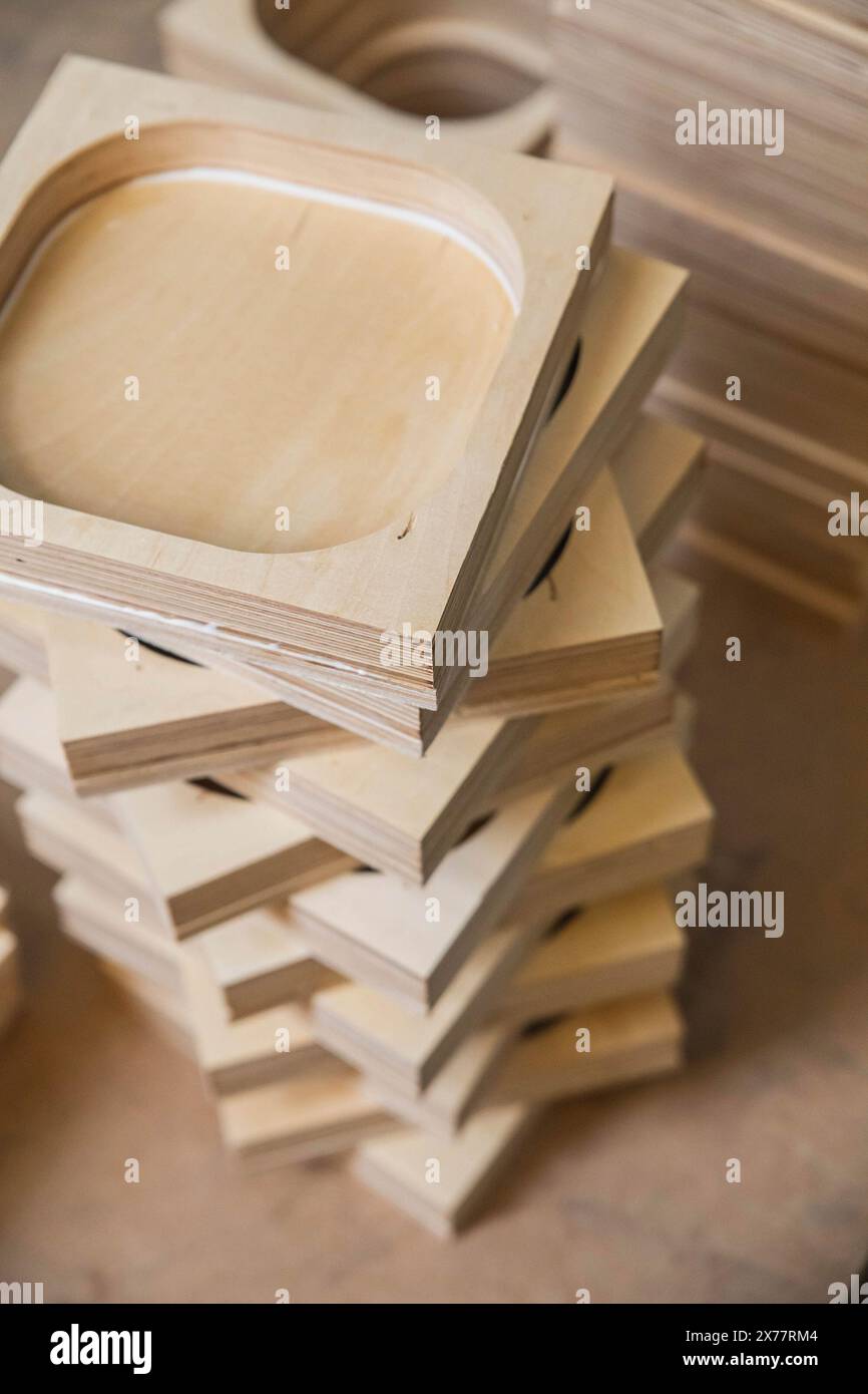 wooden bases Audio Speakers stacked like a tower at the factory Stock ...