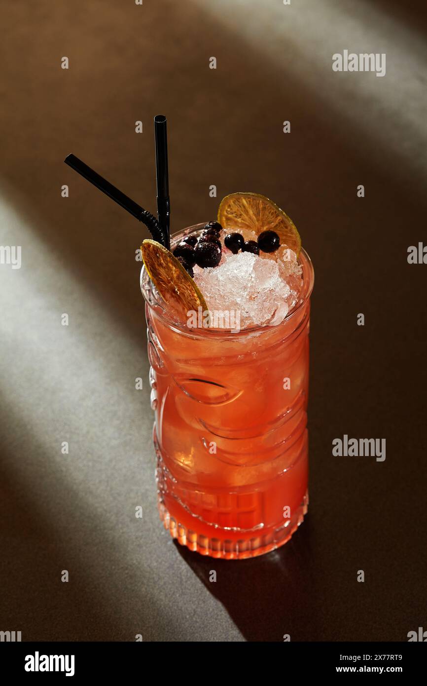 Glass od refreshing tropical cocktail with fruity and spicy notes Stock ...