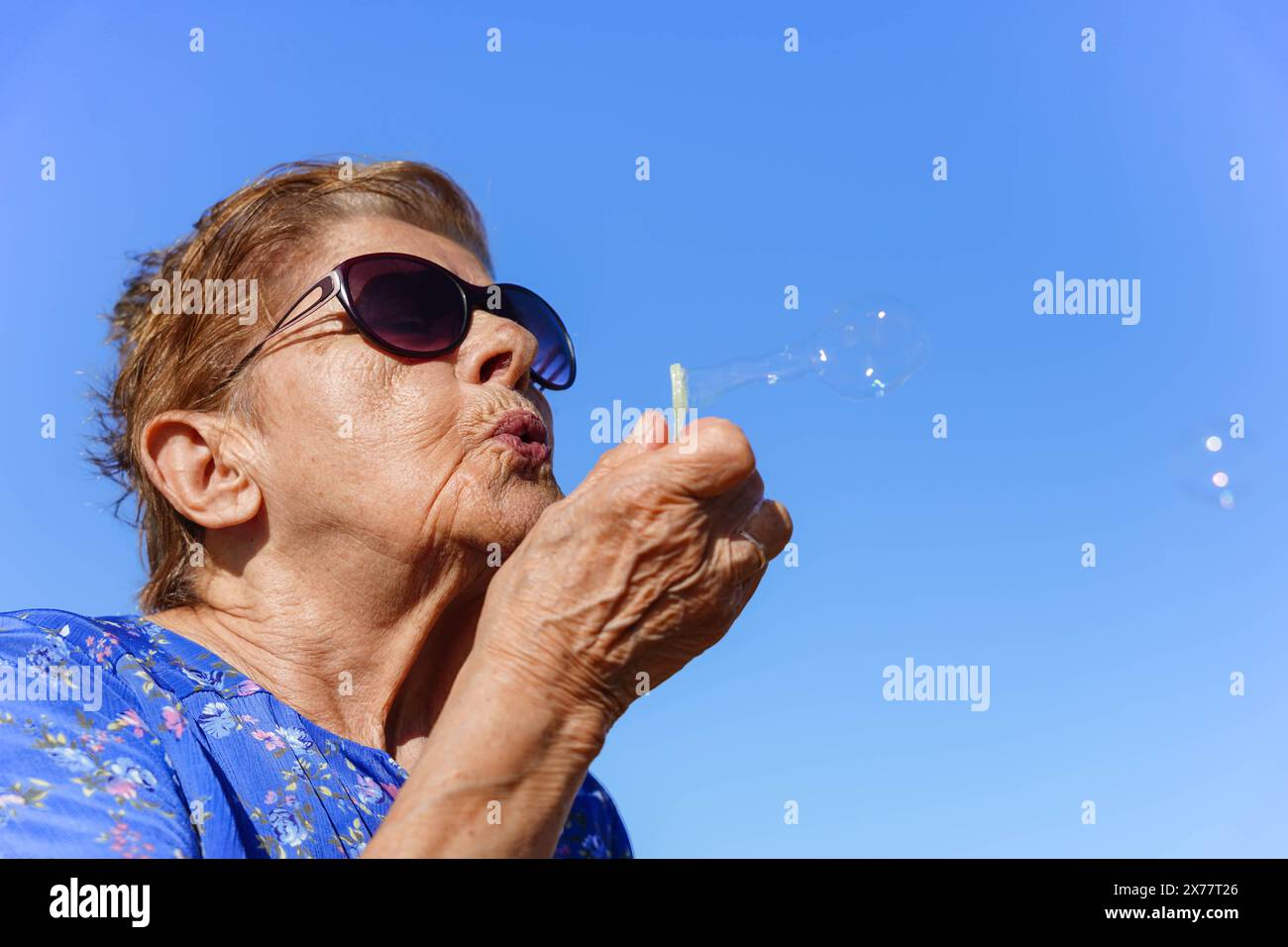Retirement woman having fun outdoors. Hobbies and leisure activities ...