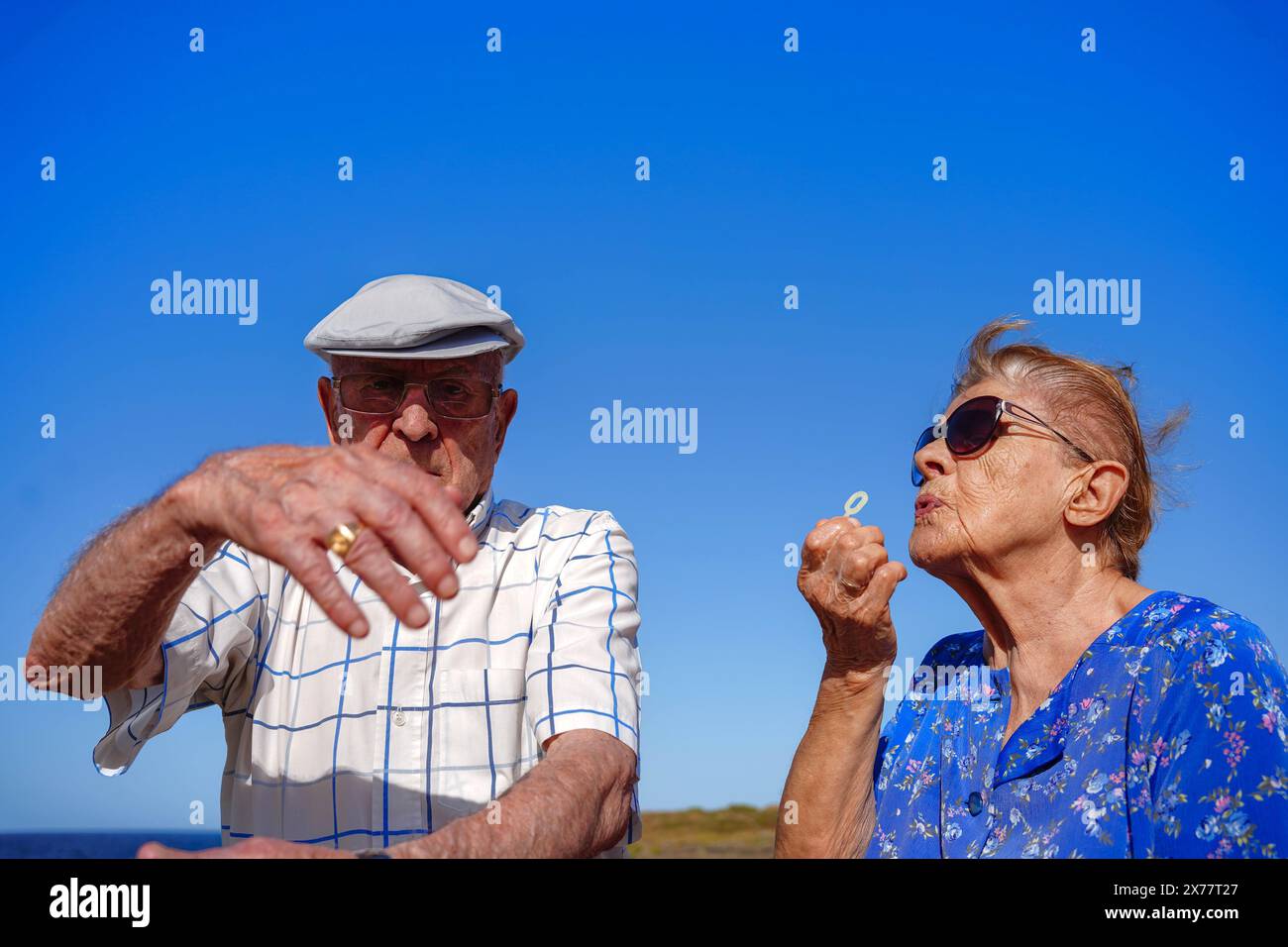 Happy active senior couple having fun outdoors. Portrait of an elderly ...