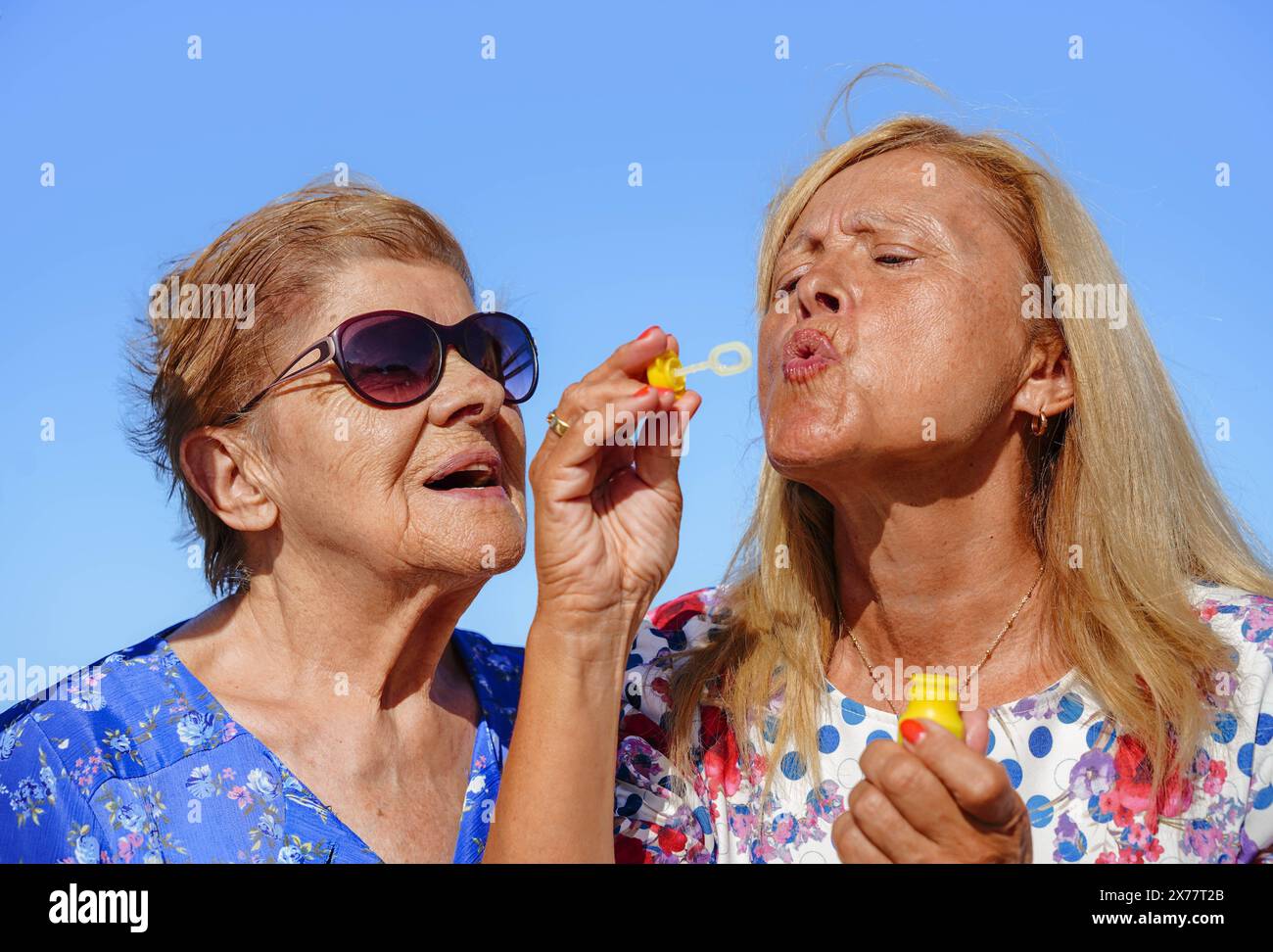 happy women family having fun outdoors in summertime. Active elderly ...