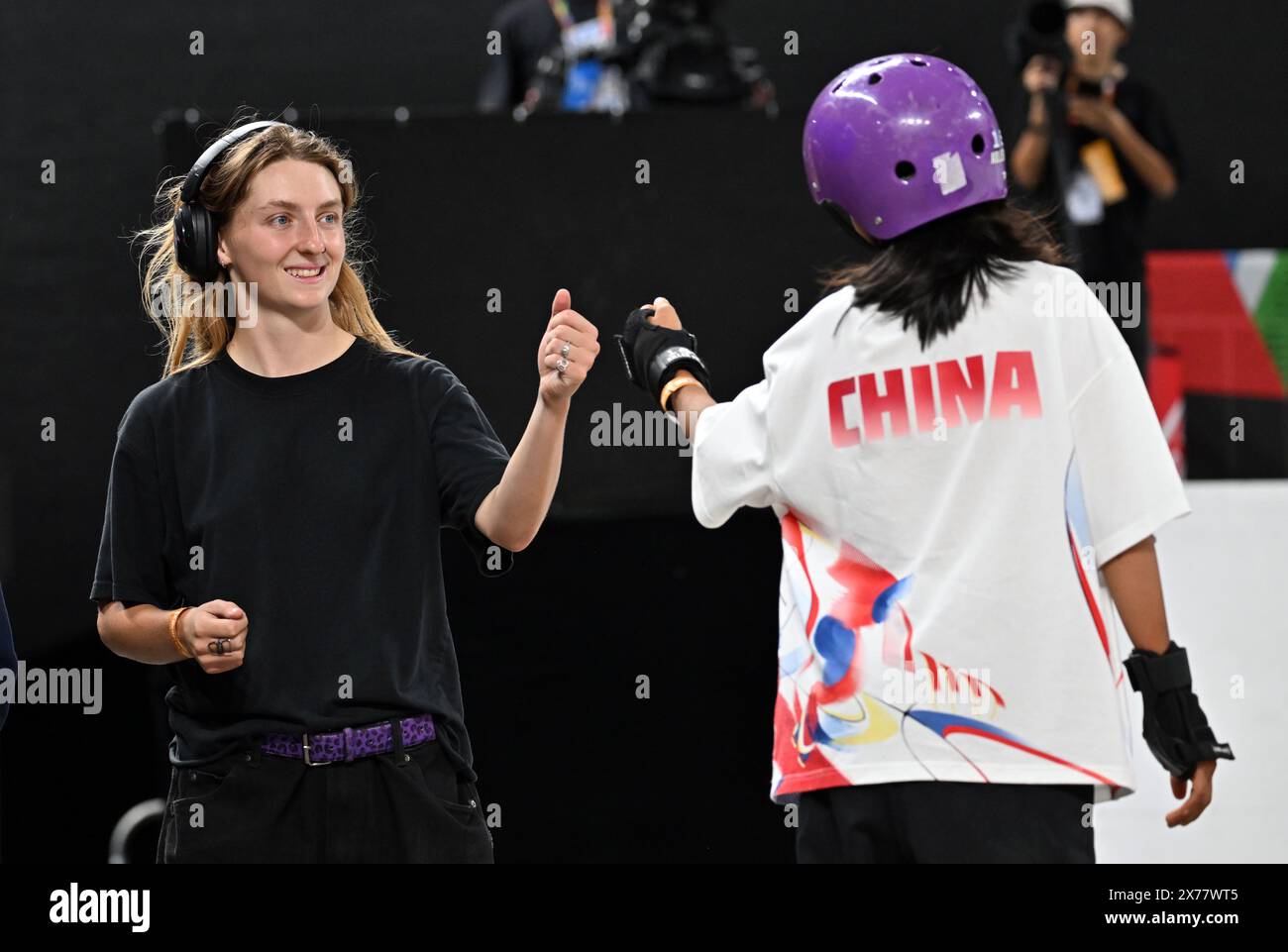 Shanghai. 18th May, 2024. Poe Pinson (L) of the United States greets ...