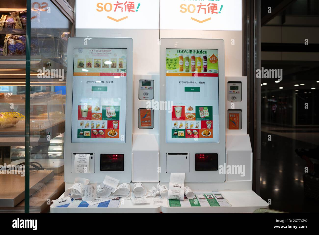 HONG KONG, CHINA - DECEMBER 04, 2023: self-checkout kiosks as seen at 7 ...