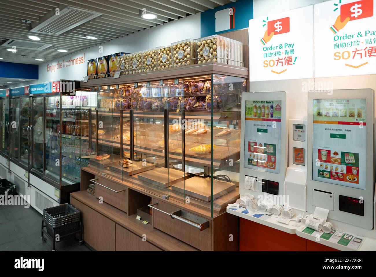 HONG KONG, CHINA - DECEMBER 04, 2023: self-checkout kiosks as seen at 7 ...
