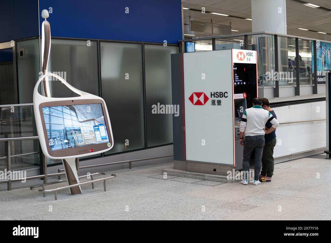 HONG KONG, CHINA - DECEMBER 04, 2023: self-service interactive kiosk and HSBC ATM as seen in ...