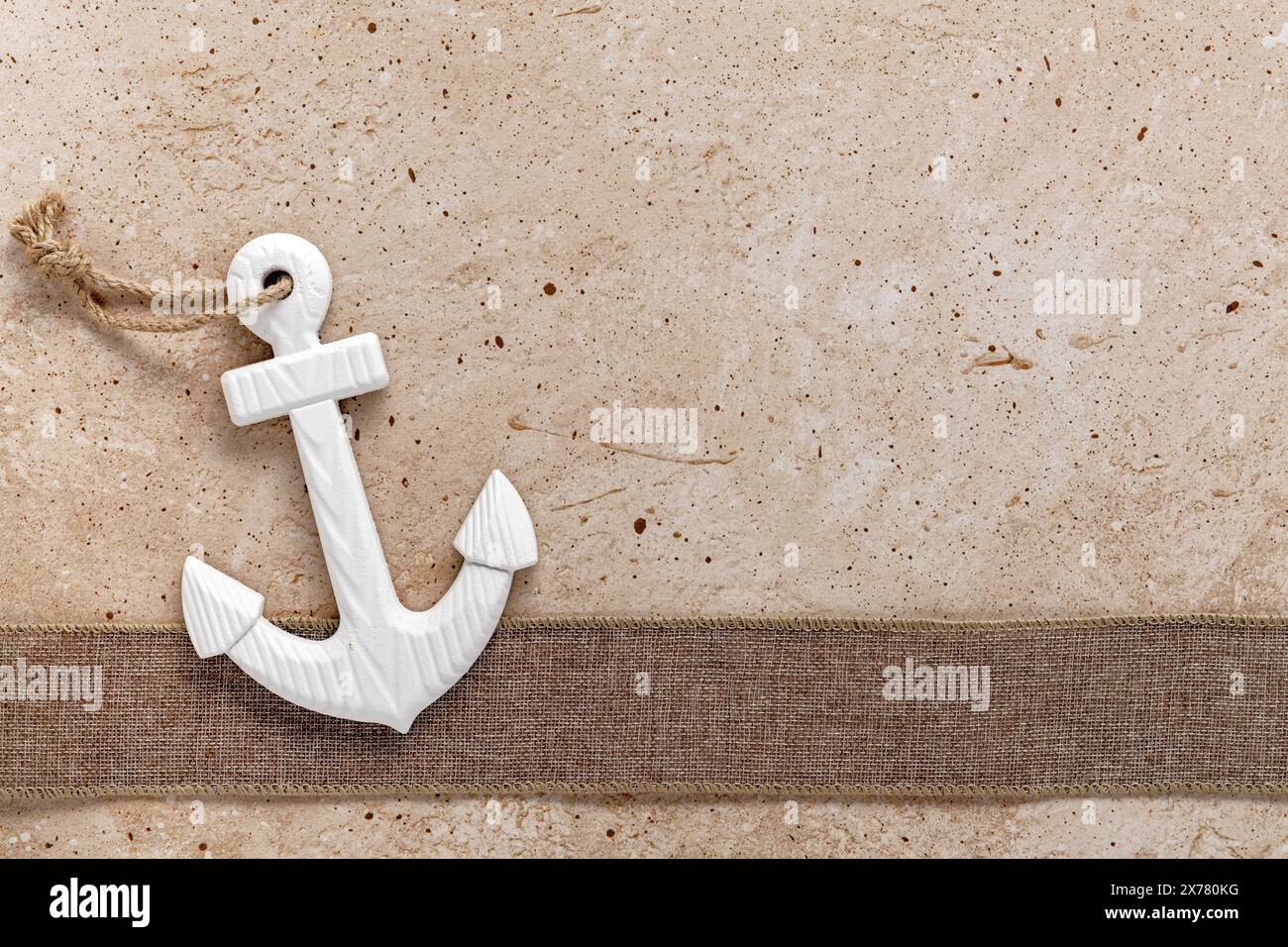 simple nautical theme neutral background with white wooden anchor on a ...