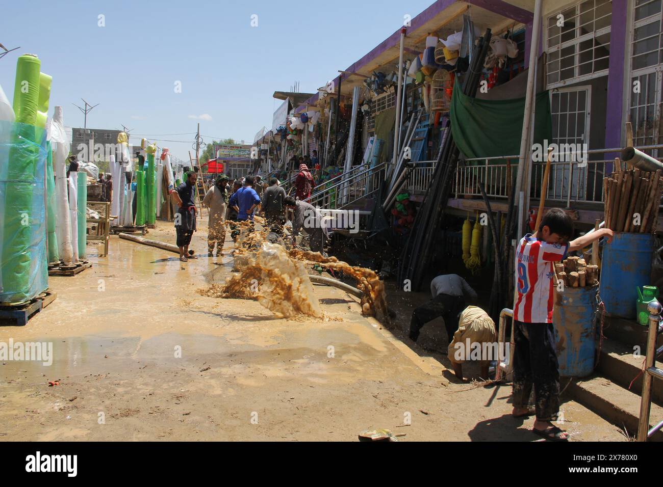 Ghor. 18th May, 2024. People clear off flood water at the flood-hit ...