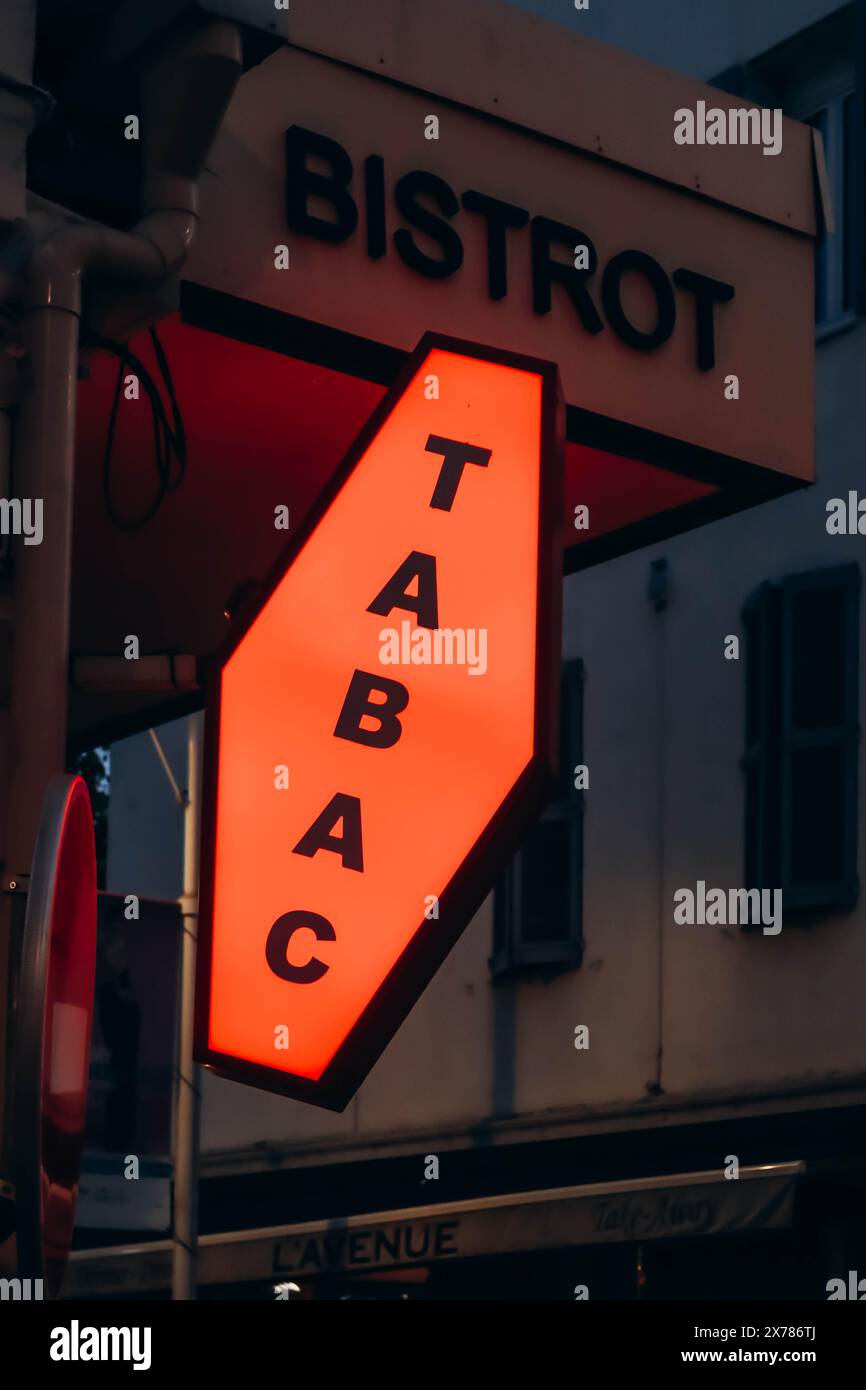 Cannes, France - August 3, 2023 : Tobacco shop sign at night in Cannes ...