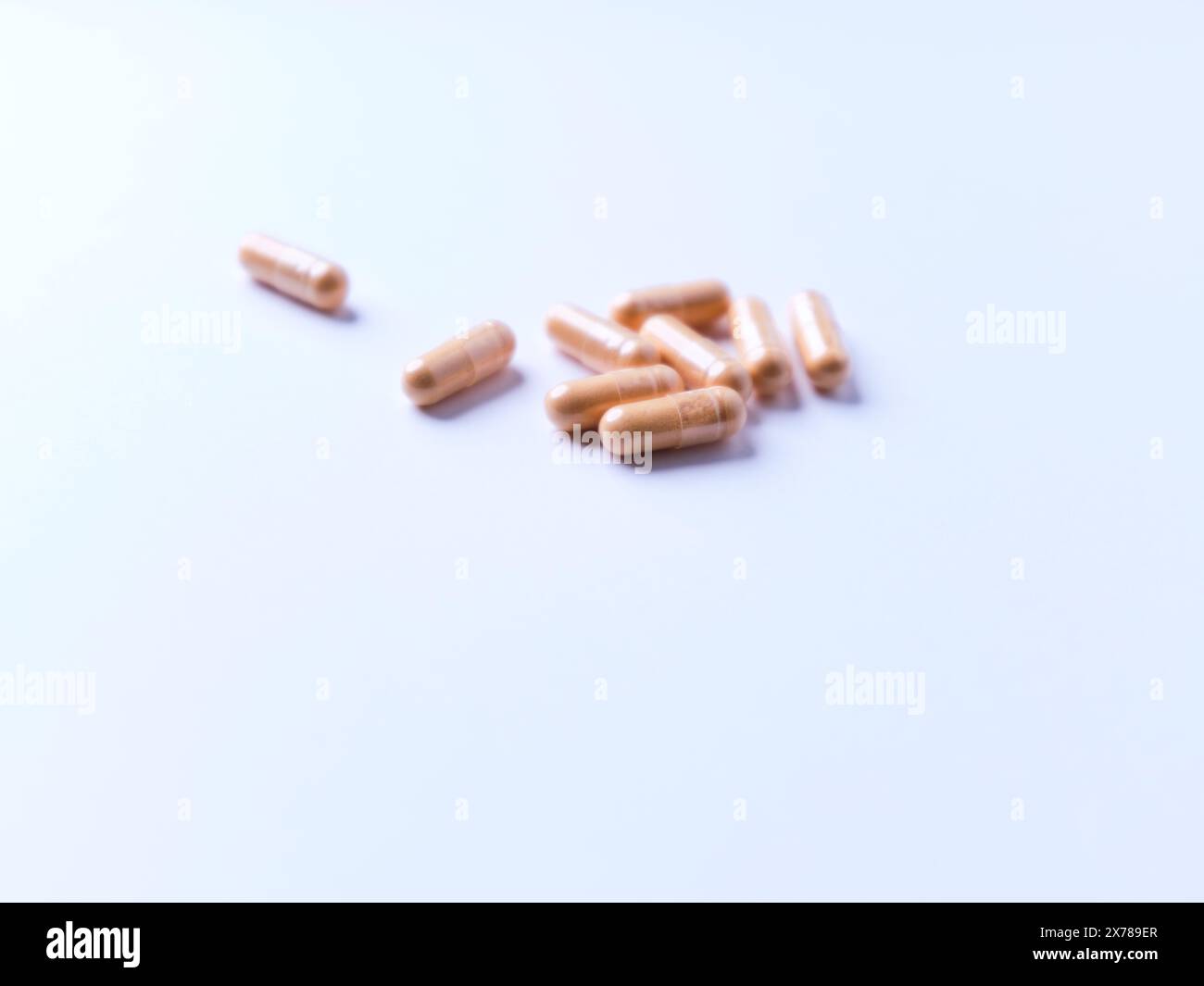 Lutein capsules. Dietary supplement on bright paper background. Soft ...