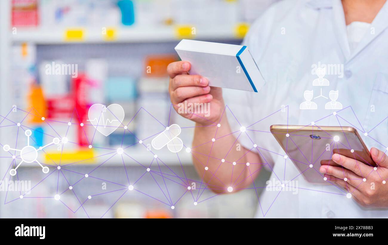 Pharmacist holding computer tablet using for filling prescription in ...
