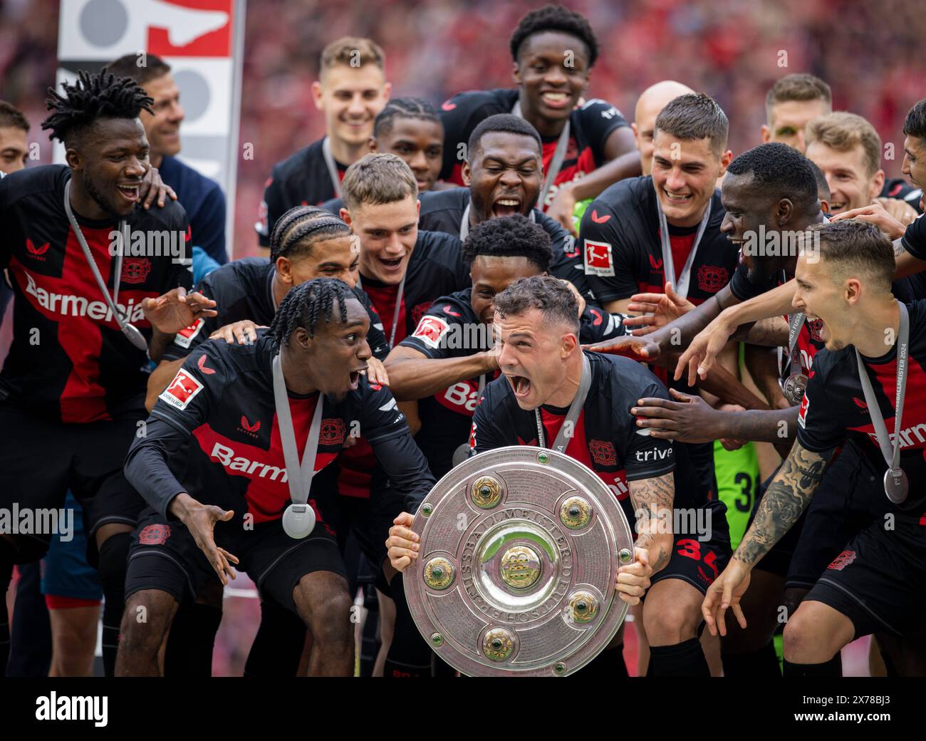 Leverkusen, Germany. 18th Mai 2024. Granit Xhaka (Leverkusen) with Trophy, Jeremie Frimpong ...
