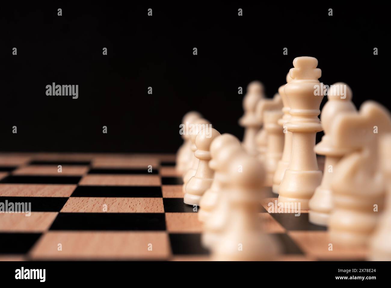 White chess set on black background with copy space Stock Photo - Alamy
