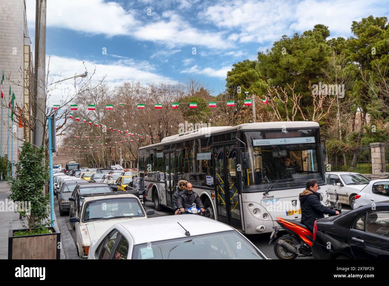 Tehran, Iran - March 7, 2024: A bustling city street is filled with ...