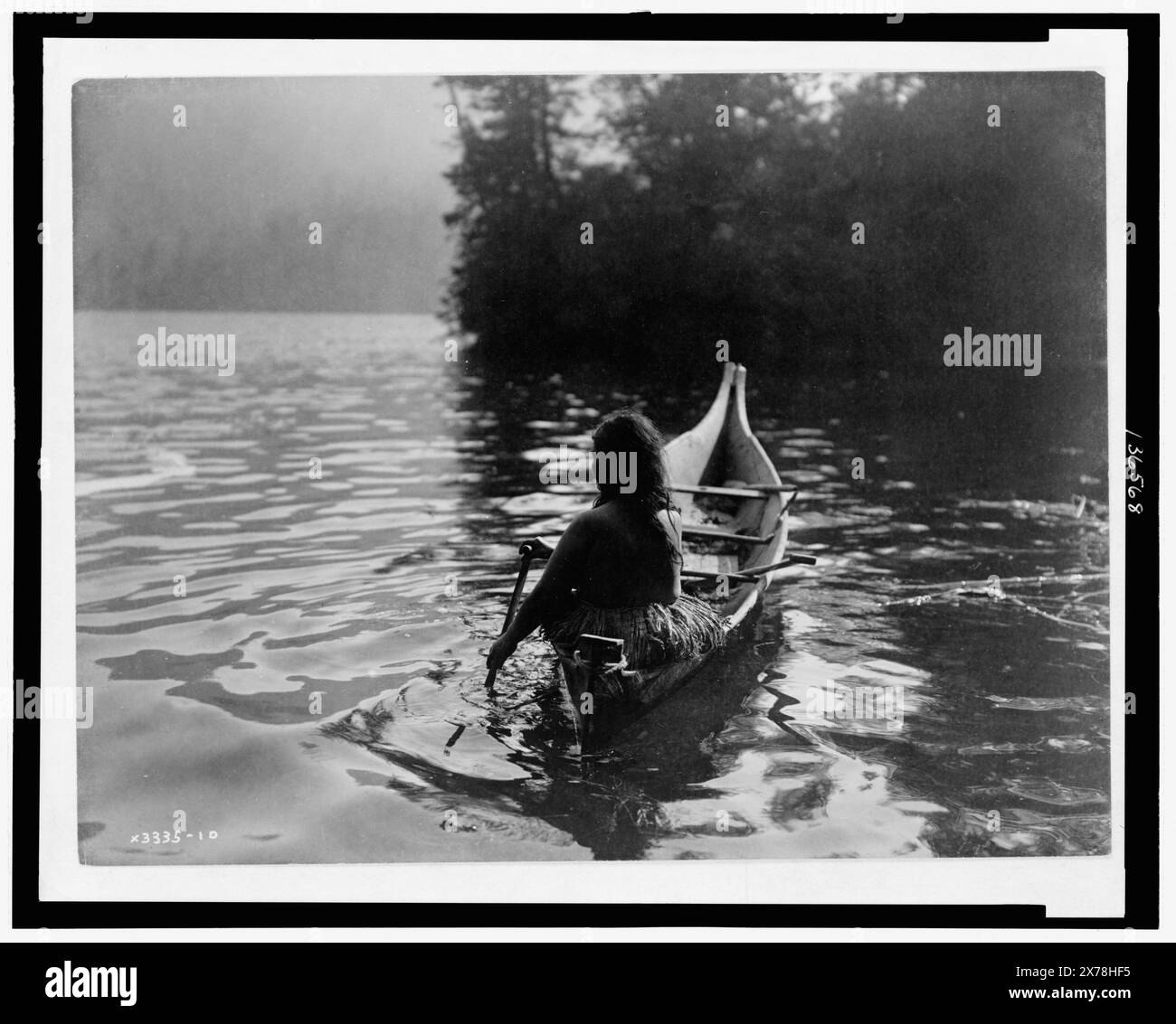 Into the shadow Clayoquot, Clayoquot Indian paddling canoe into area ...