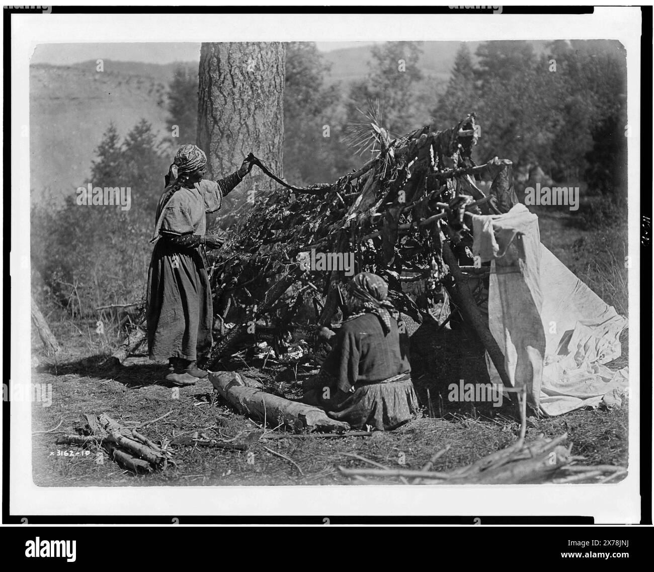 Drying meat Flathead, Title from item., Curtis no. 3162-10., Forms part ...