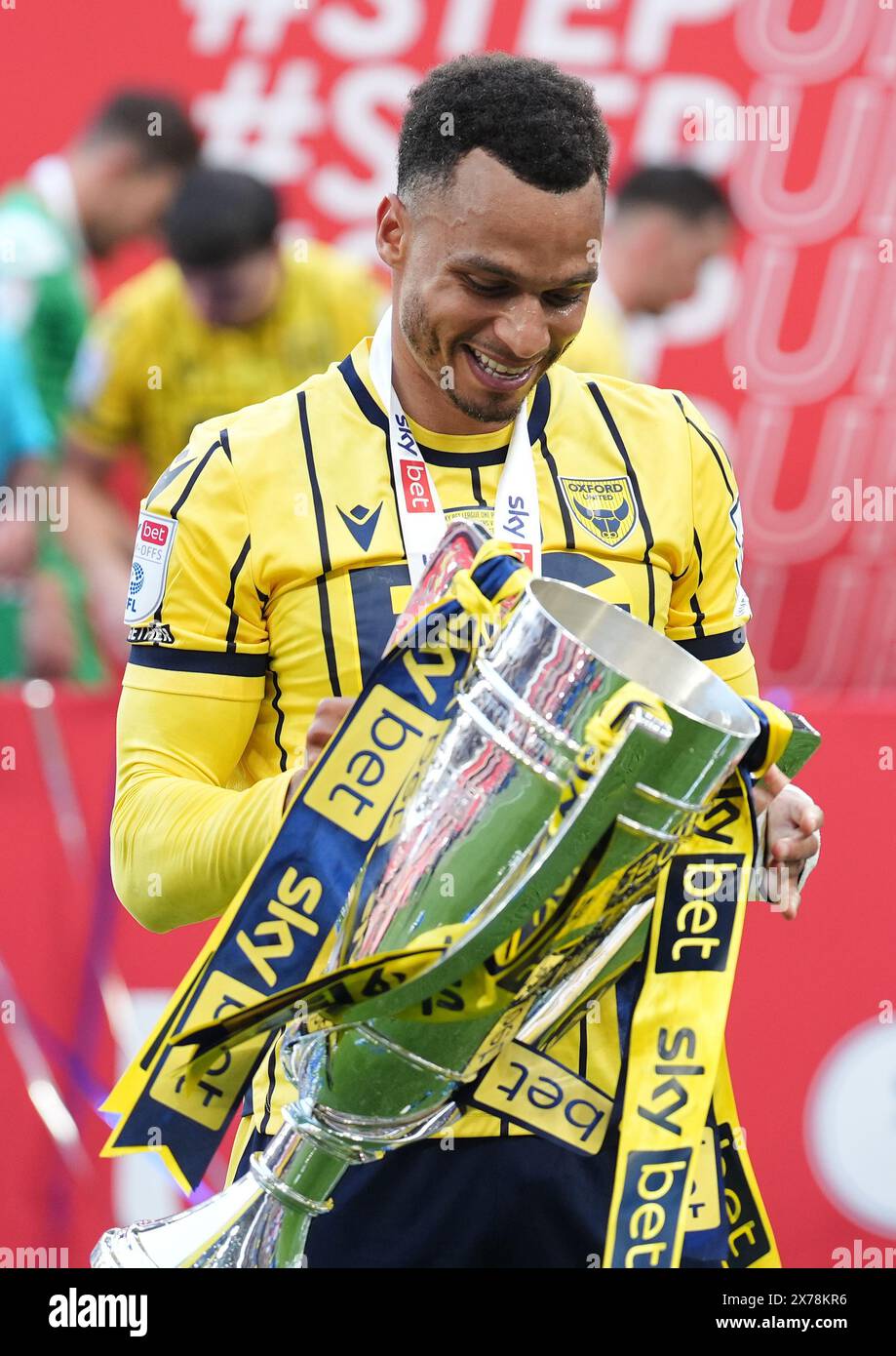 Oxford United's Josh Murphy with the trophy during celebrations as ...