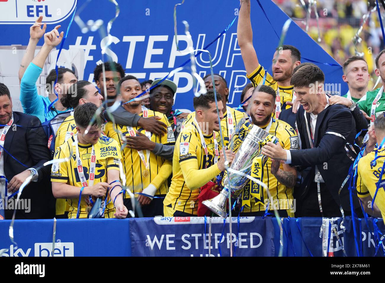 Oxford United lift the trophy during celebrations as their side is ...