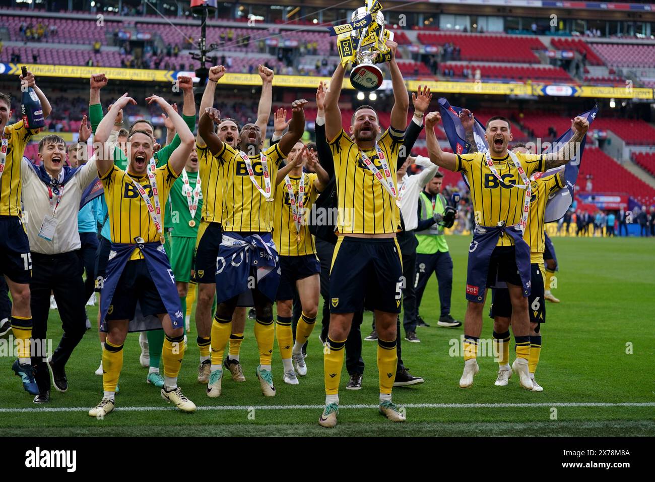 Oxford United's Elliott Moore lifts the trophy after the Sky Bet League ...