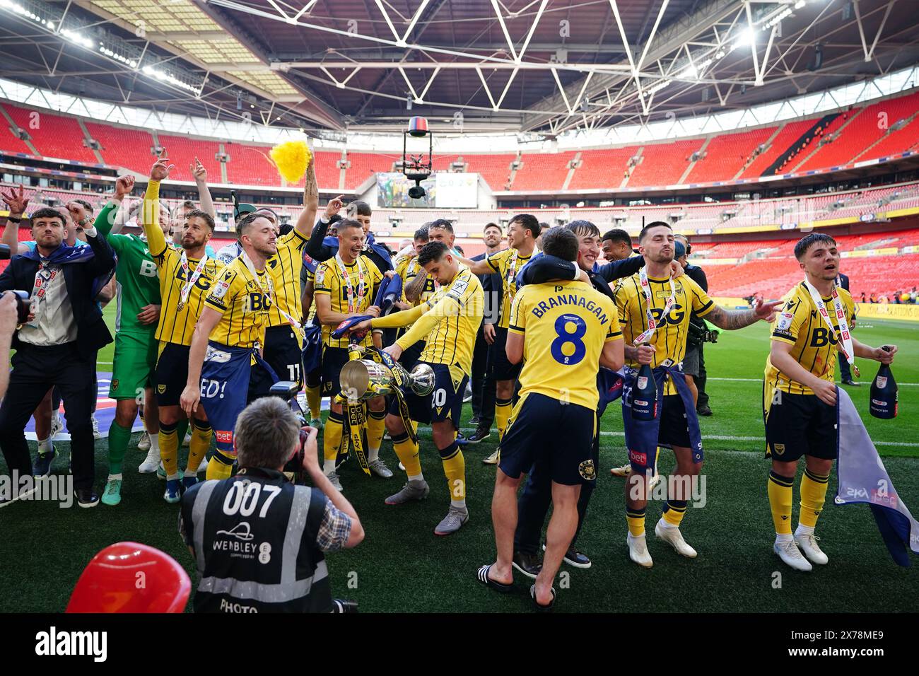Oxford United with the trophy during celebrations as their side is ...