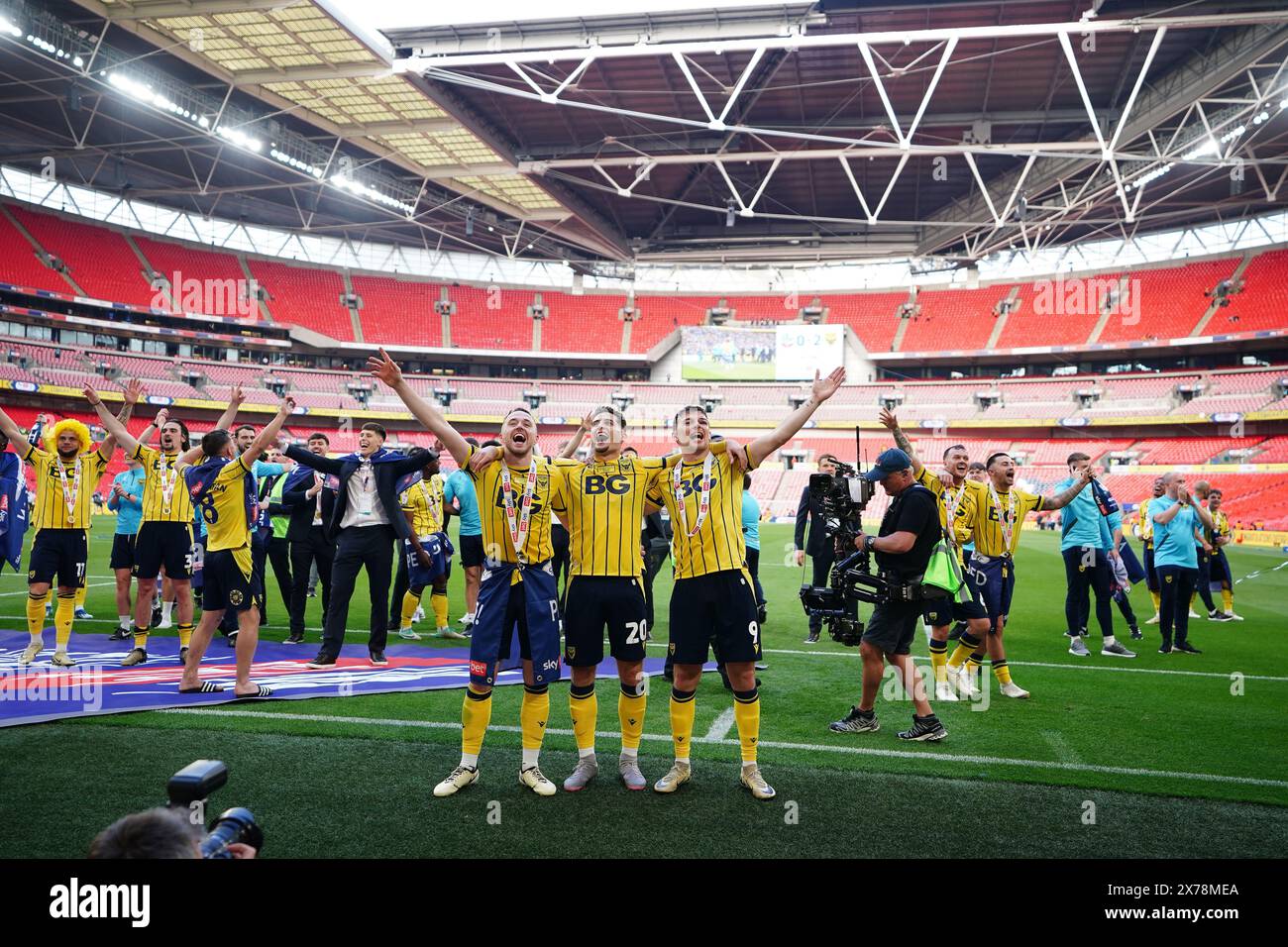 Oxford United with the trophy during celebrations as their side is ...