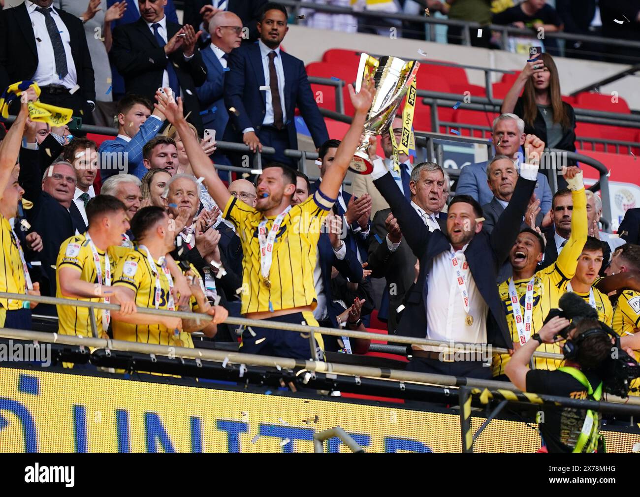 Oxford United lift the trophy during celebrations as their side is ...
