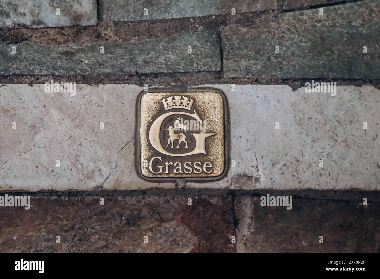 Grasse, France - July 23, 2023: Emblem of Grasse on the pavement in the ...