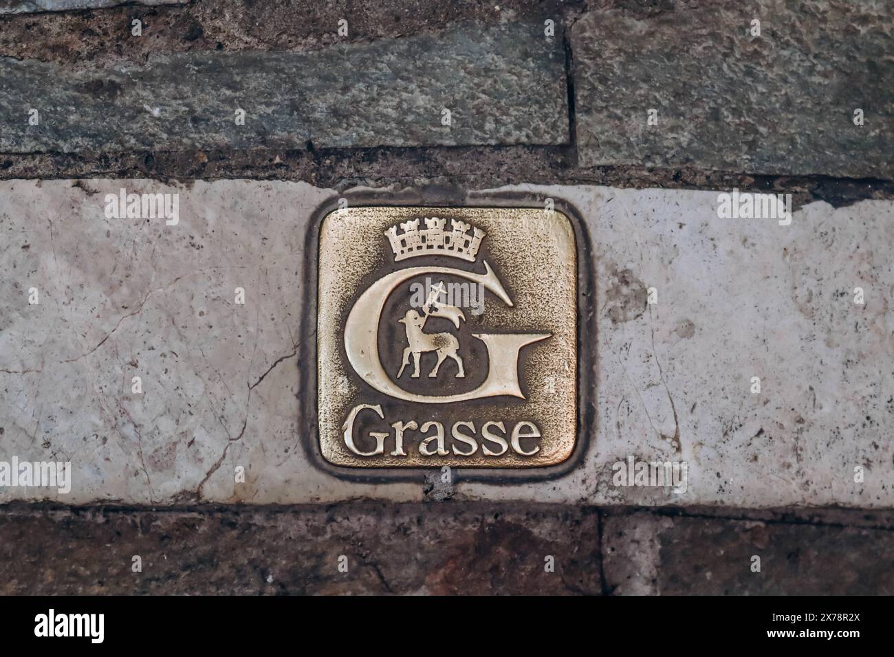 Grasse, France - July 23, 2023: Emblem of Grasse on the pavement in the ...