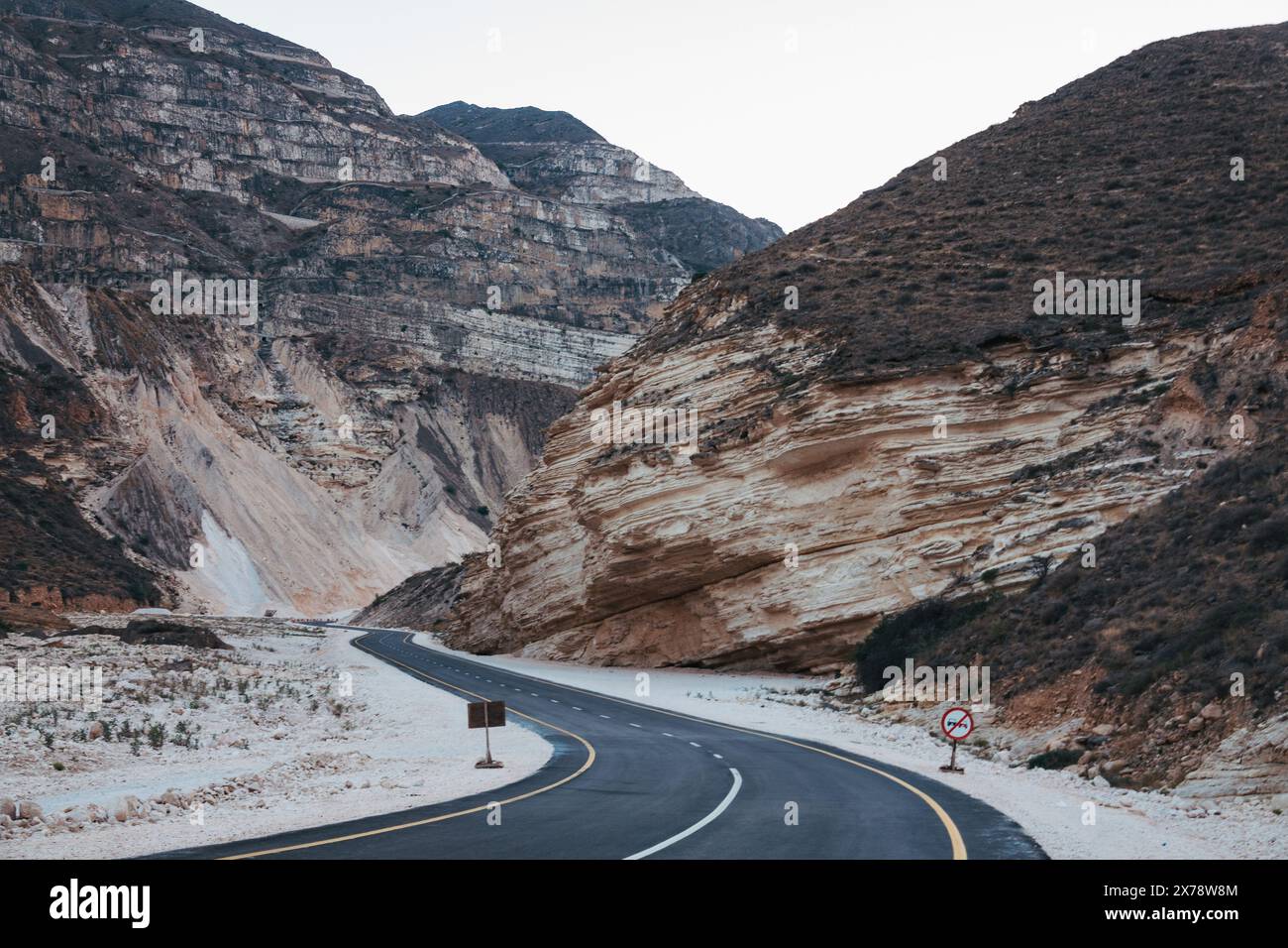 Empty Mountain Road Winding Through a Canyon at Sunset in rural Salalah ...