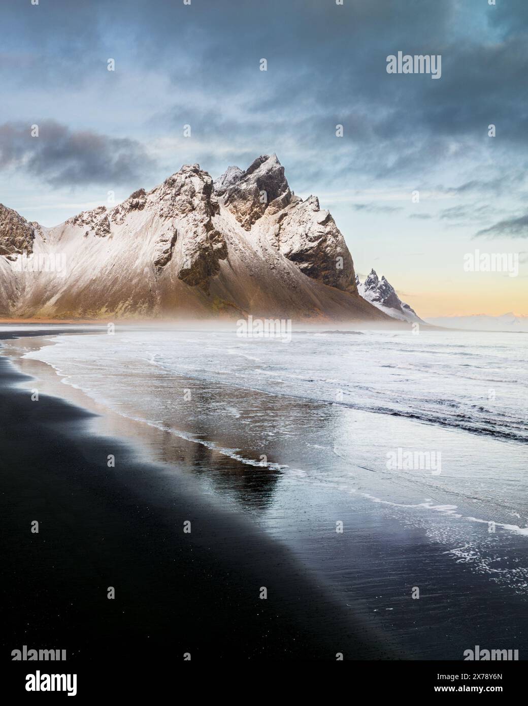 Snow-covered Vestrahorn mountain and icy landscape at Stokksnes beach ...