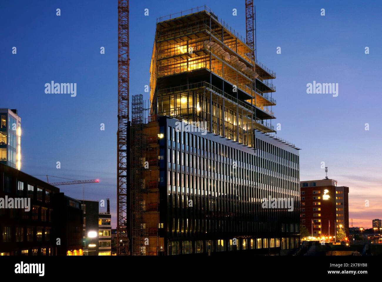 Building construction site in night, look up view Stock Photo - Alamy